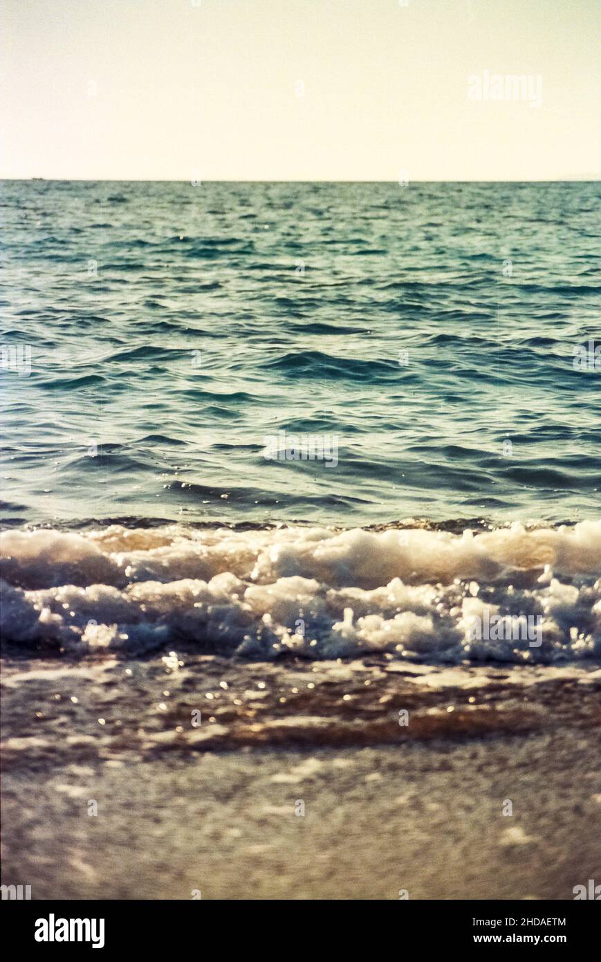 Patterns and foam of waves in the ocean, shot with analogue color film ...