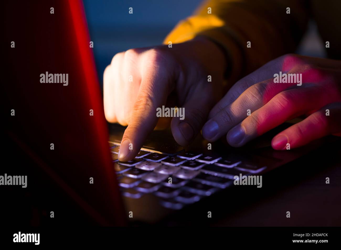 Hand types on laptop keyboard hi-res stock photography and images - Alamy