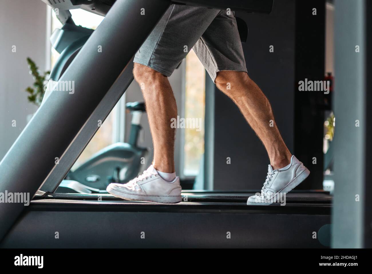 International Day of Sport. Close up of feet of sporty man training on ...