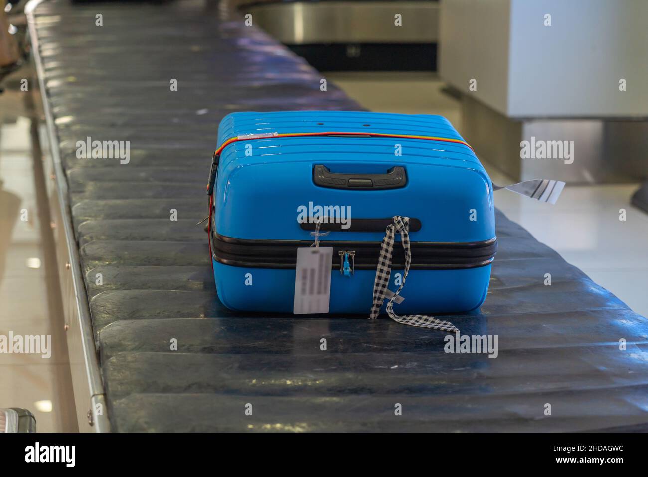 Passenger luggage on conveyor belt at arrival terminal in airport Stock ...