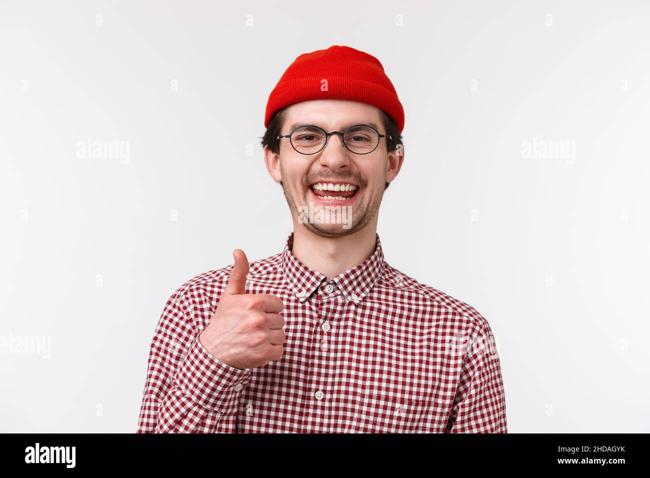 Very good. Satisfied young man approve new product, smiling and ...