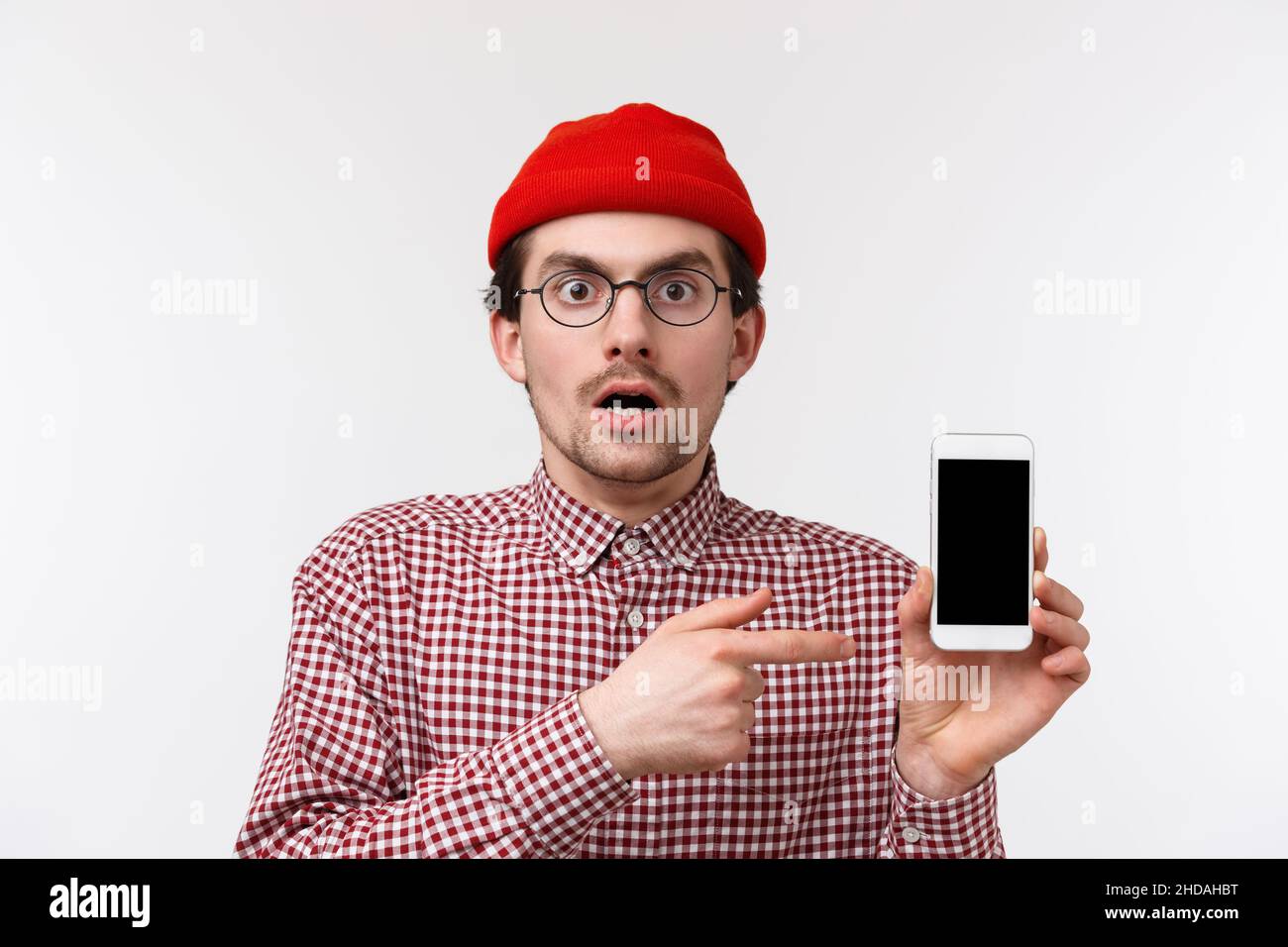 Technology and people concept. Close-up portrait impressed young man ...