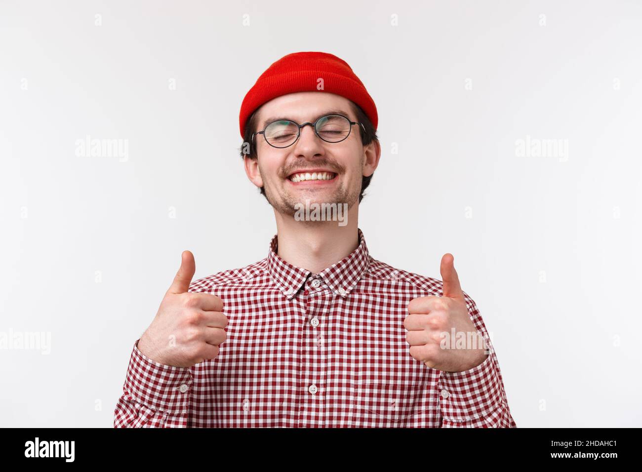 Very good. Close-up portrait satisfied handsome young man with ...