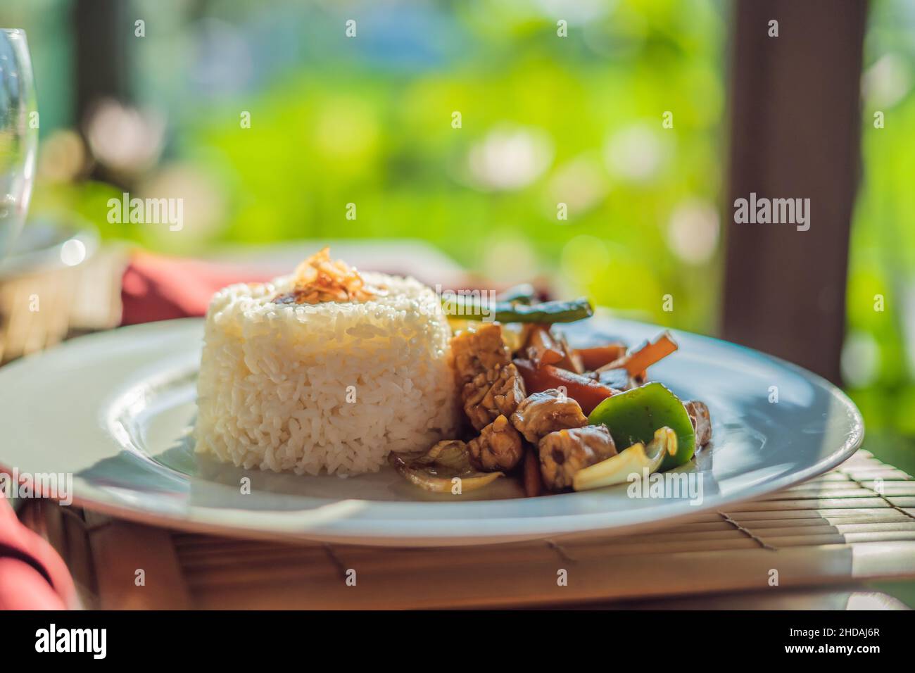 Traditional Balinese cuisine. Vegetable and tofu stir-fry with rice ...