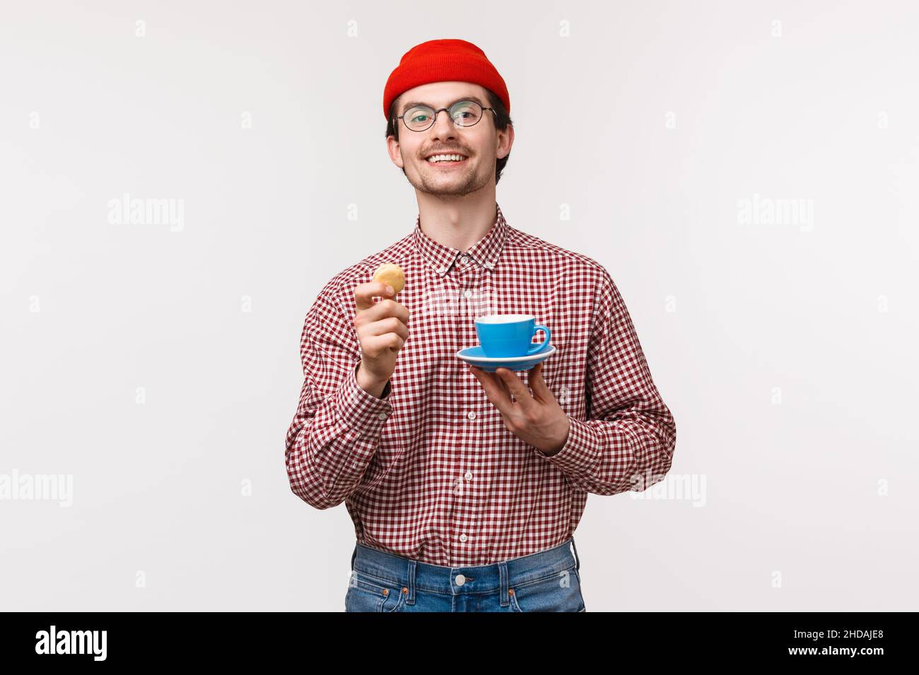 Cheerful handsome and relaxed young caucasian bearded man enjoying his ...