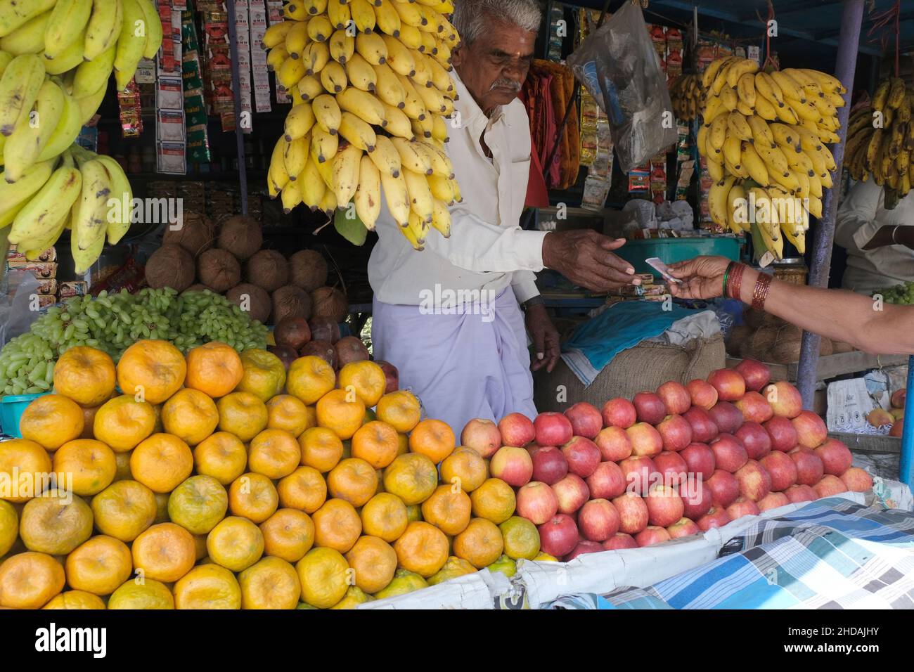 20 December 2021, Indian fruit and vegetable vendor selling their ...