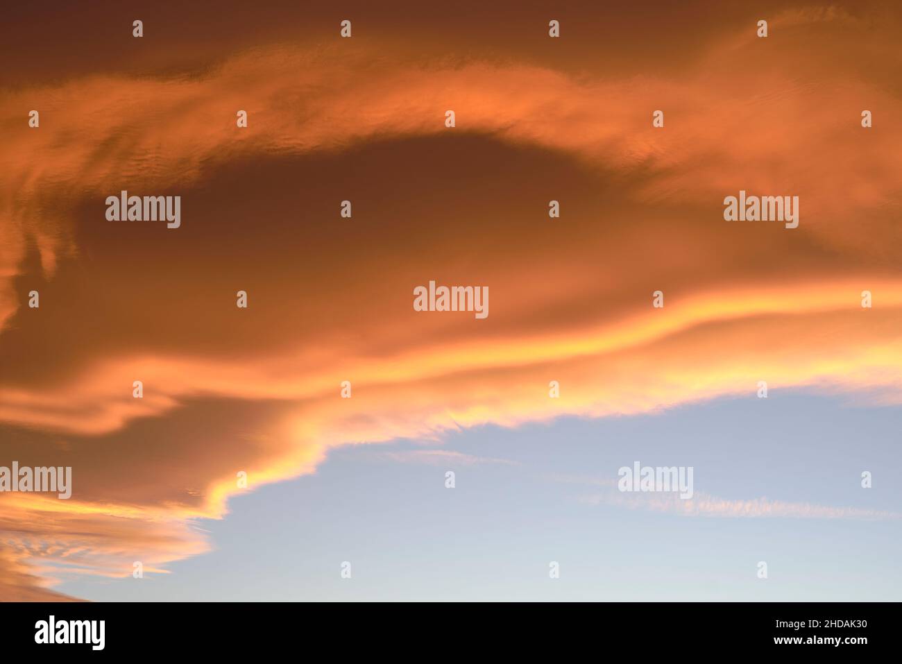 A Sunset. Heaven, orange sky. Sun rays. Wallpaper. Clouds Stock Photo - Alamy