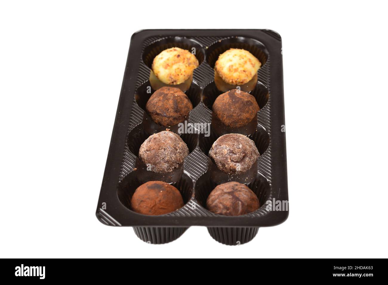 Chocolate candy collection in plastic box Stock Photo - Alamy