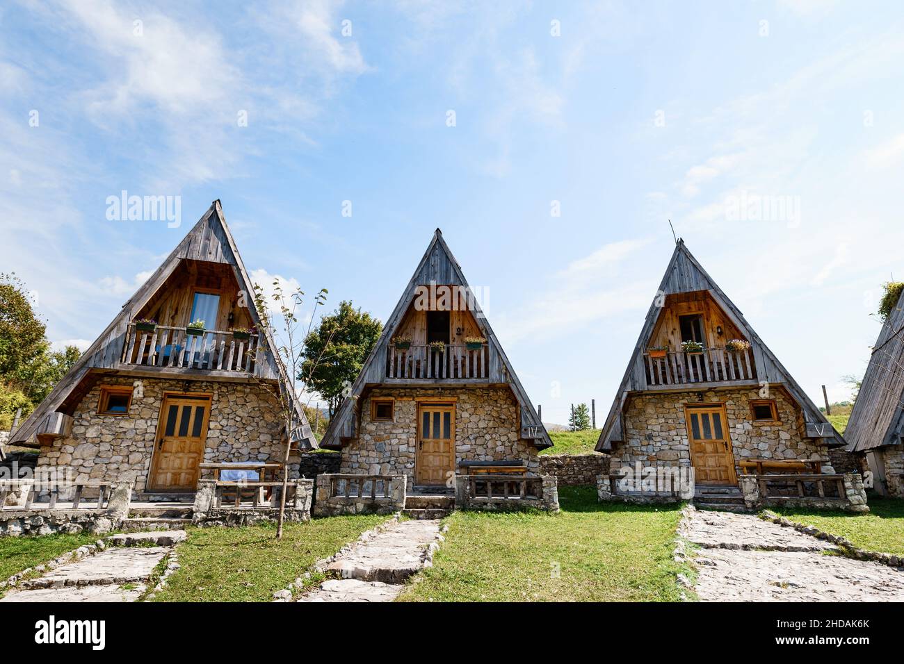 Row of two-storey triangular stone houses. Montenegro, north Stock ...