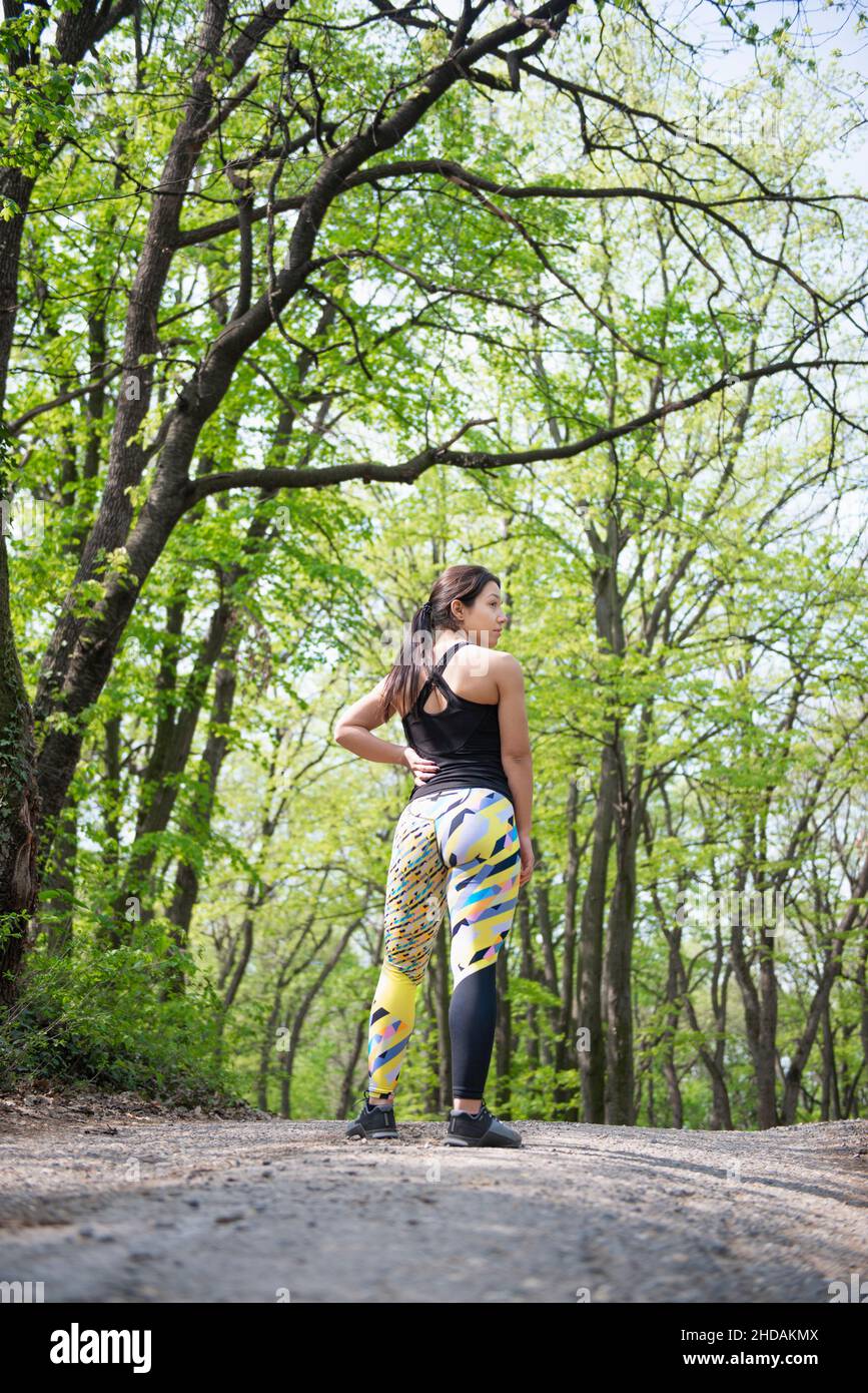 Girl posing in her colorful yoga pants Stock Photo - Alamy