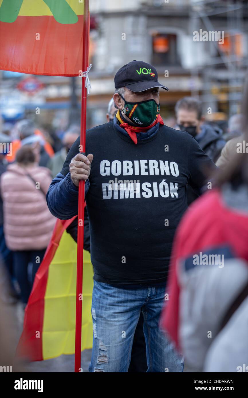 Vertical shot of a man wearing a shirt with the text ''government ...