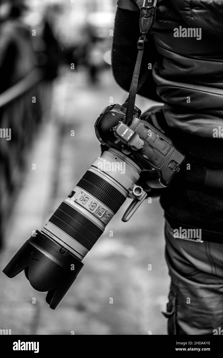 Grayscale shot of a camera during the demonstration against the reform ...
