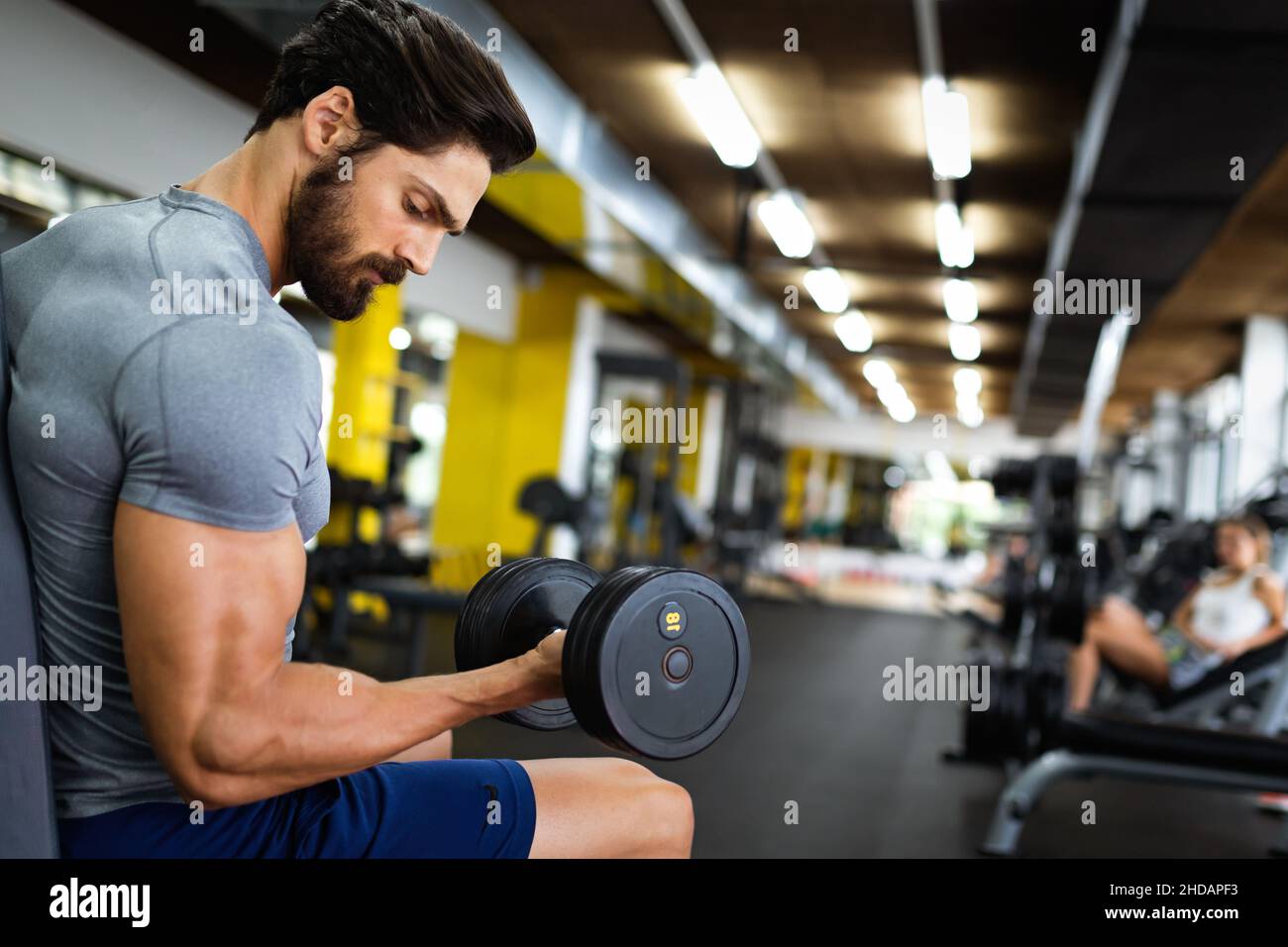 Portrait of fit man working out in gym. Sport people healthy lifestyle ...