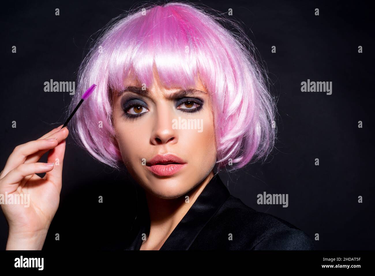 Eyebrow makeup. Beauty funny model shaping brows with brow pencil ...