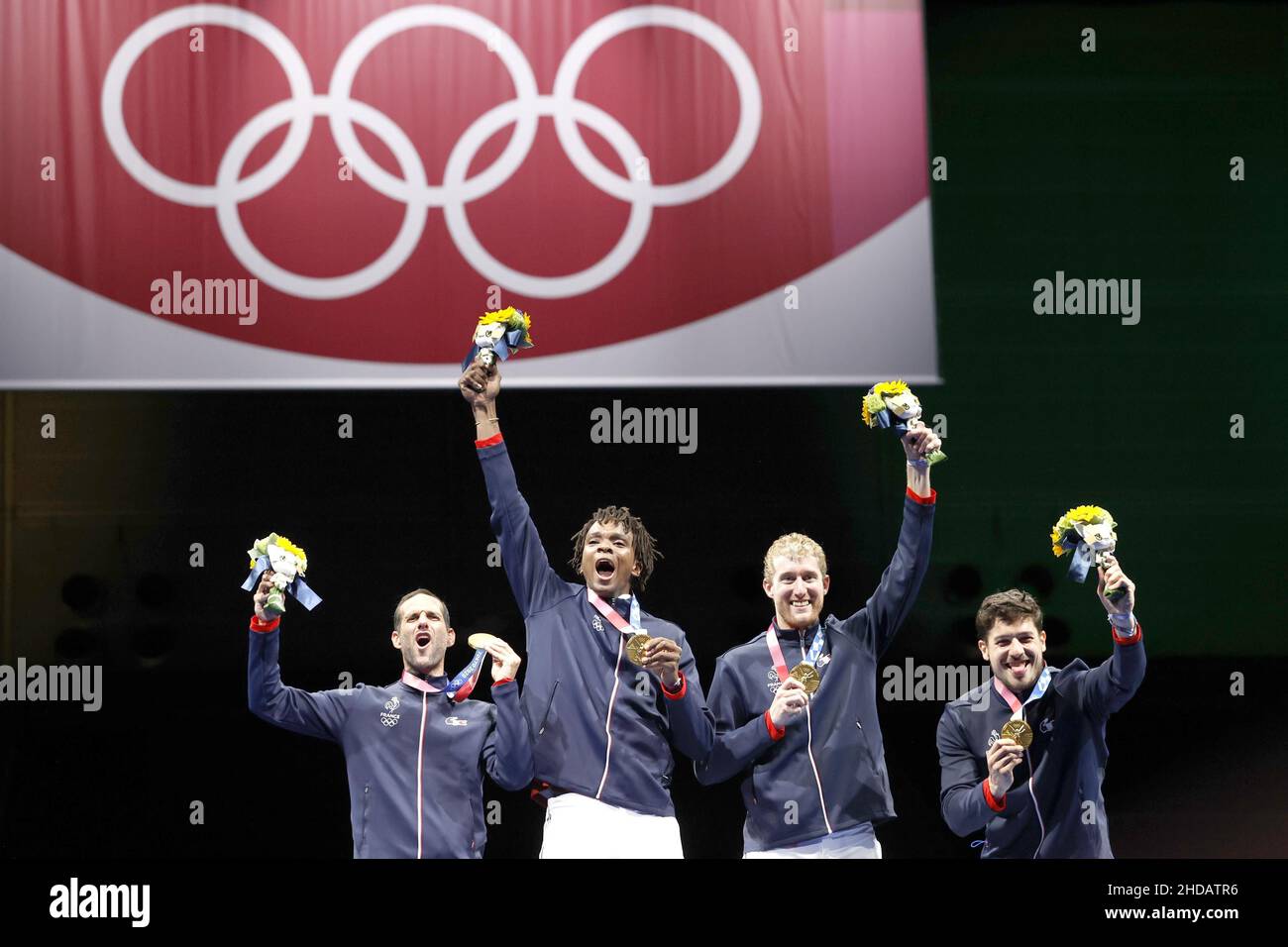 French fencers celebrate after winning gold in the men's foil team ...