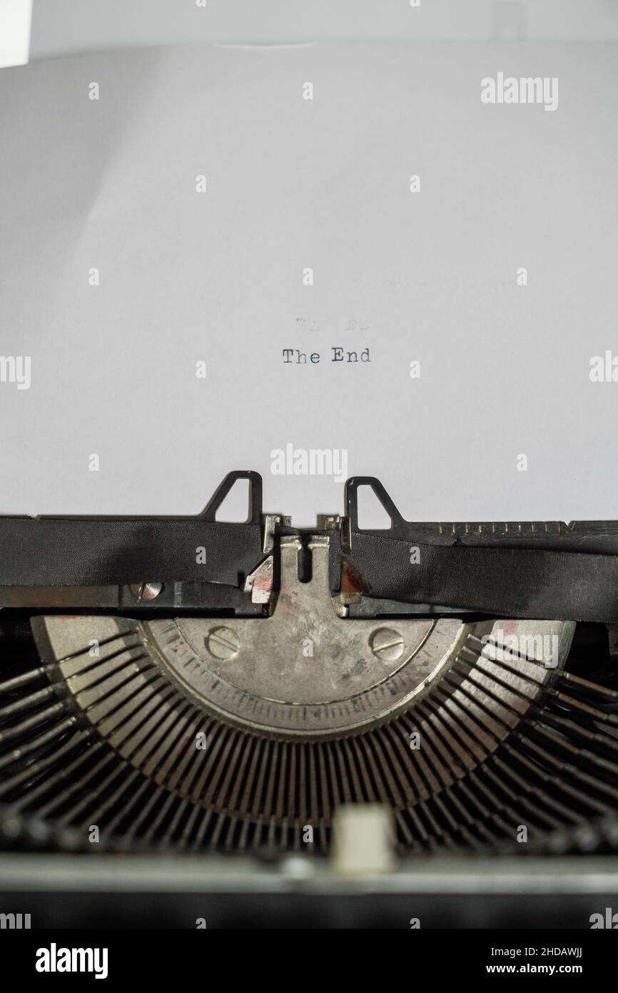 The end writed on old retro typewriter machine Stock Photo - Alamy
