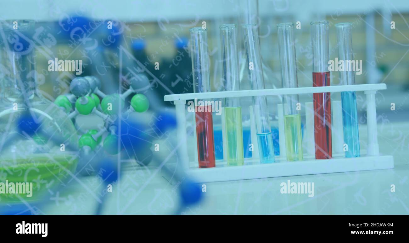 Image of mathematical and scientific formulae over chemistry laboratory ...