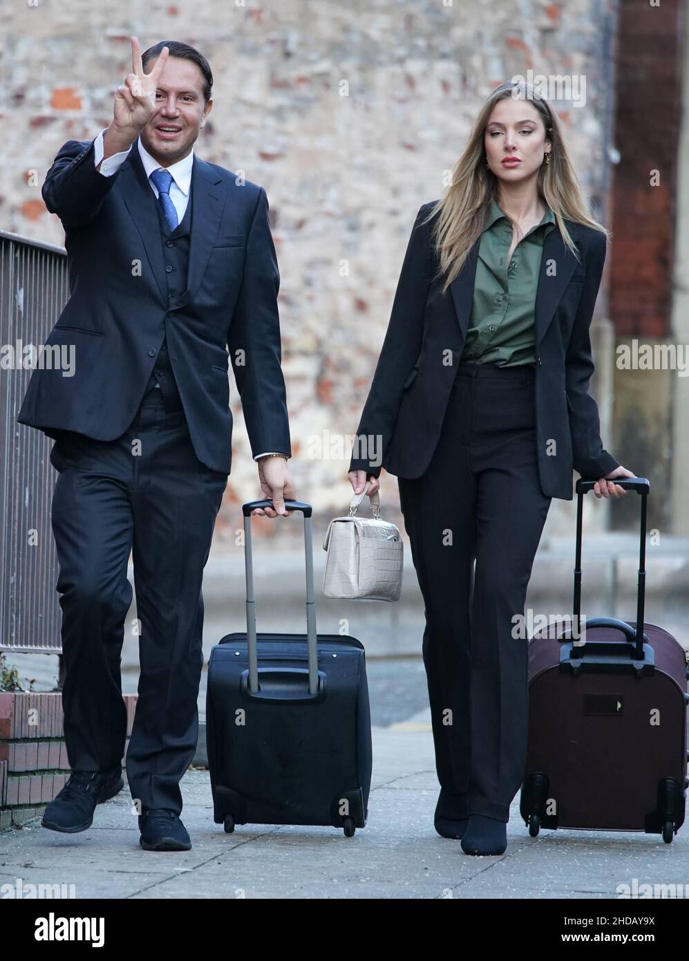 Socialite James Stunt (left) makes a hand gesture as he arrives at ...