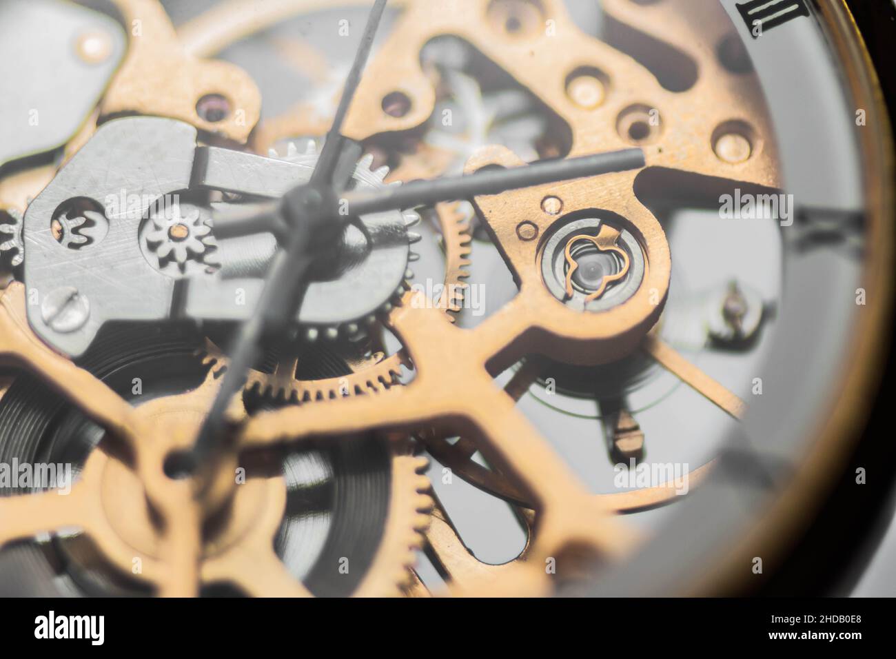 Closeup detail of the internal mechanism of a vintage analog clockwork ...