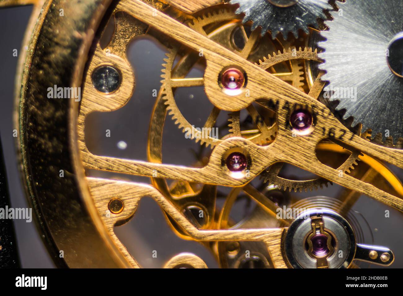 Closeup detail of the internal mechanism of a vintage analog clockwork ...