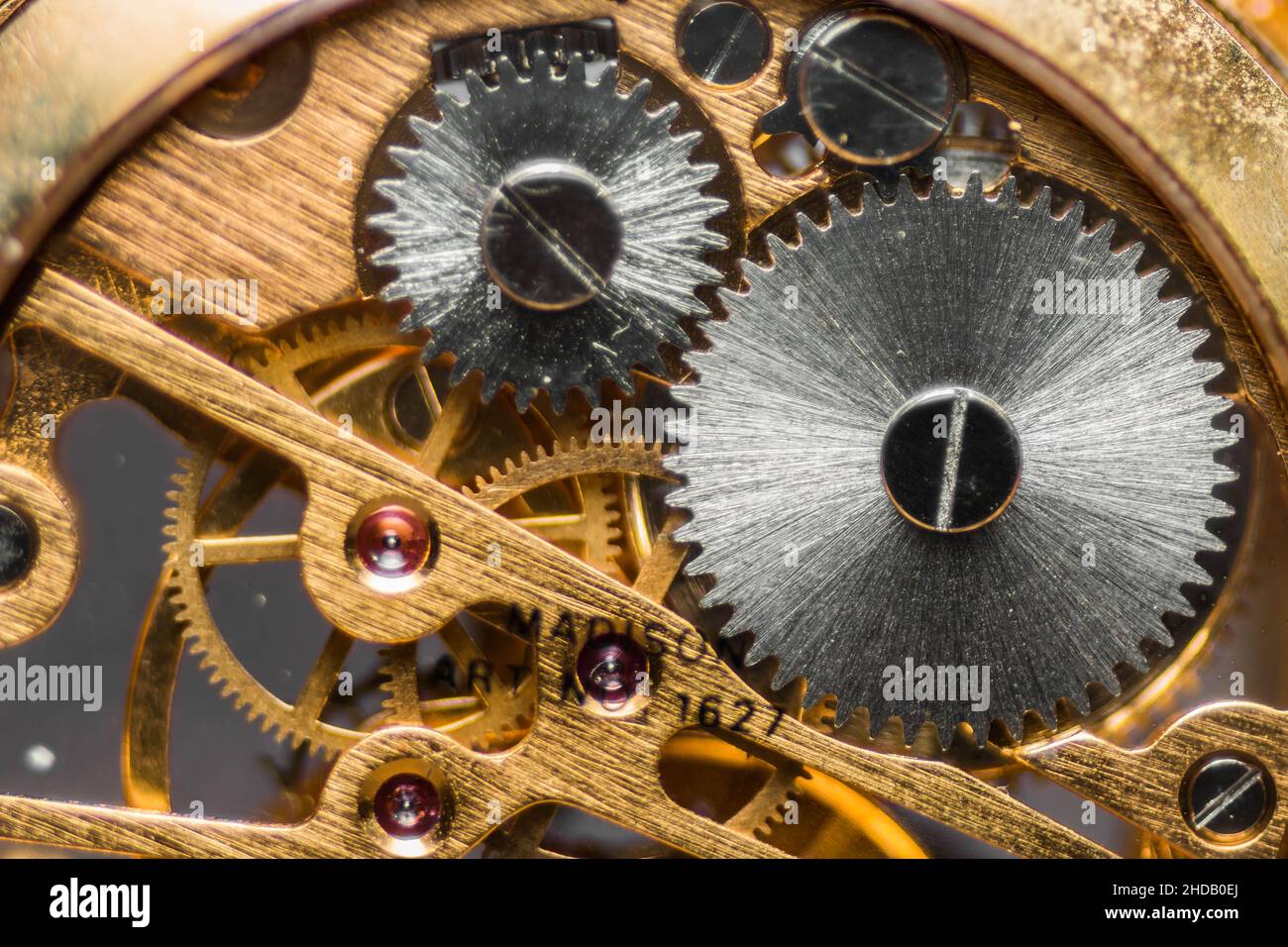 Closeup detail of the internal mechanism of a vintage analog clockwork ...