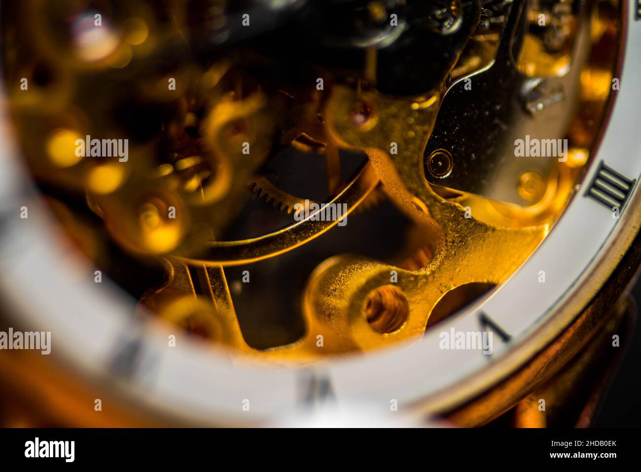 Closeup detail of the internal mechanism of a vintage analog clockwork ...