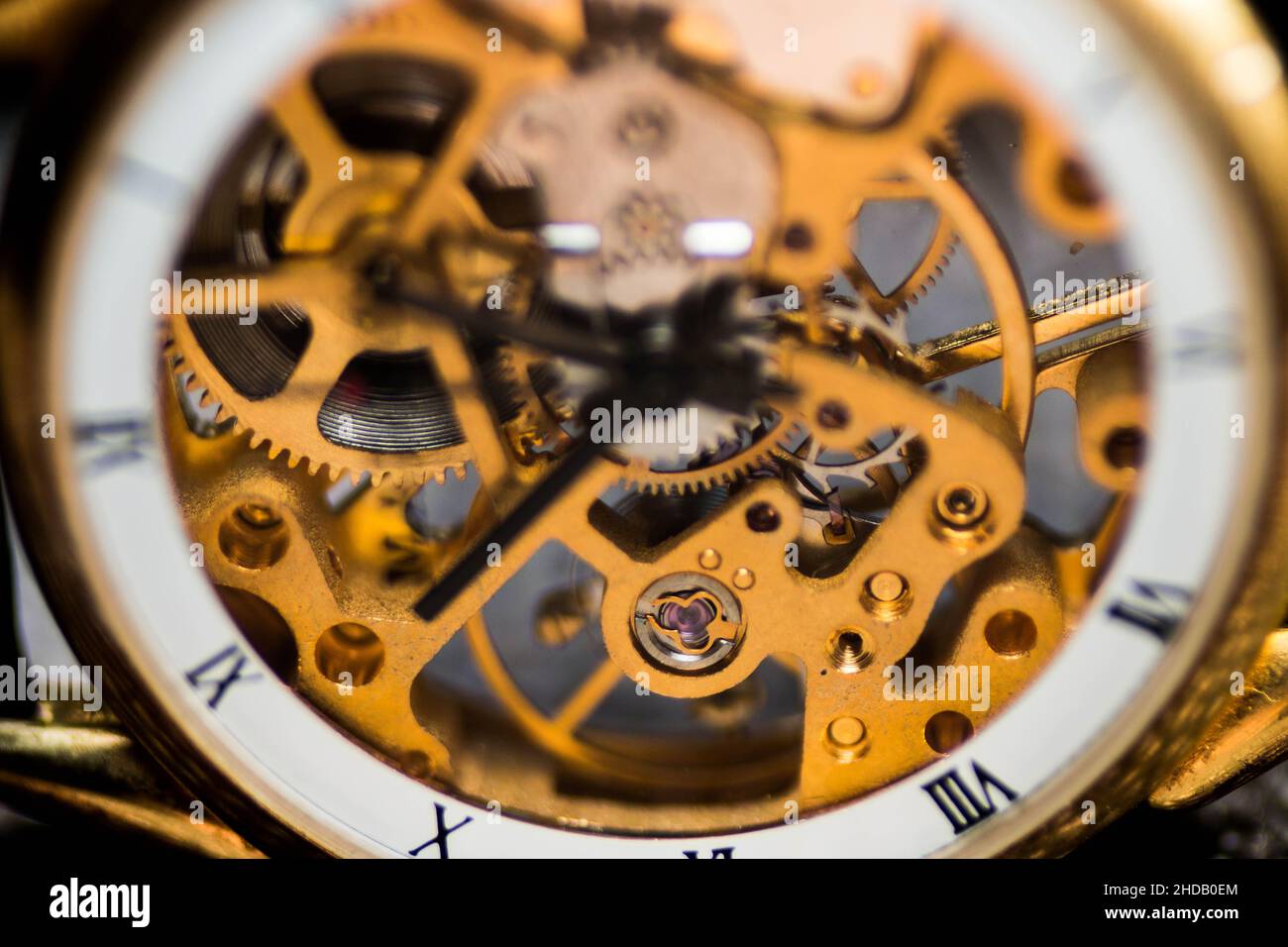Closeup detail of the internal mechanism of a vintage analog clockwork ...