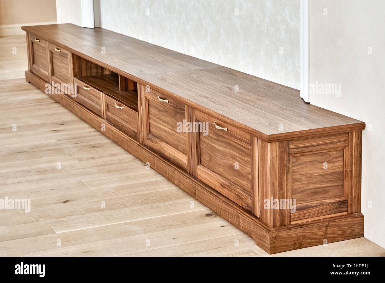 Elegant new TV cabinet made of veneer and solid walnut lumber with gold ...