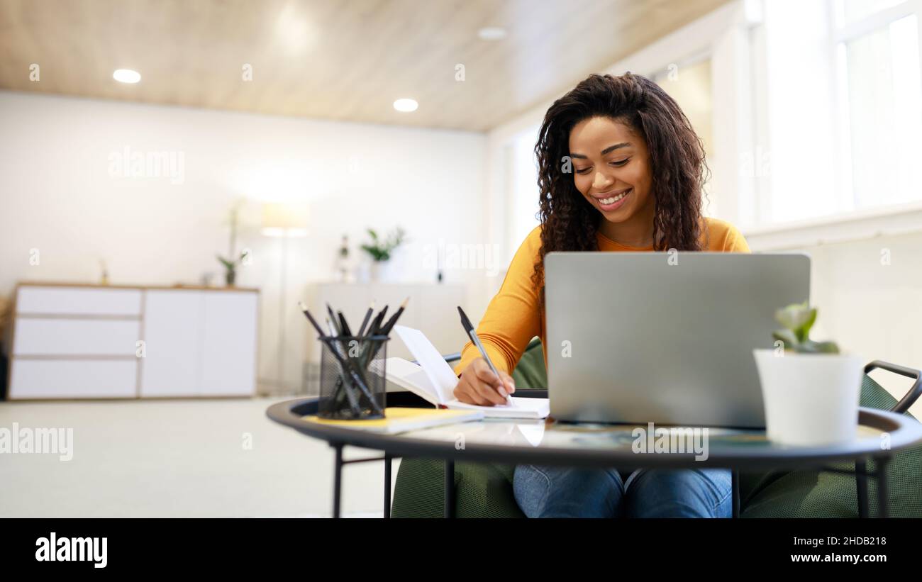Black woman laptop writing student hi-res stock photography and images ...