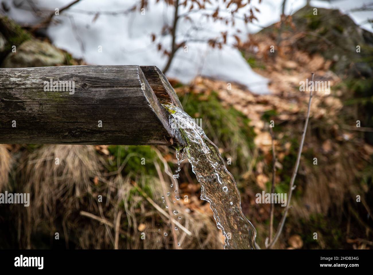 water flowing out of wood trough Stock Photo - Alamy