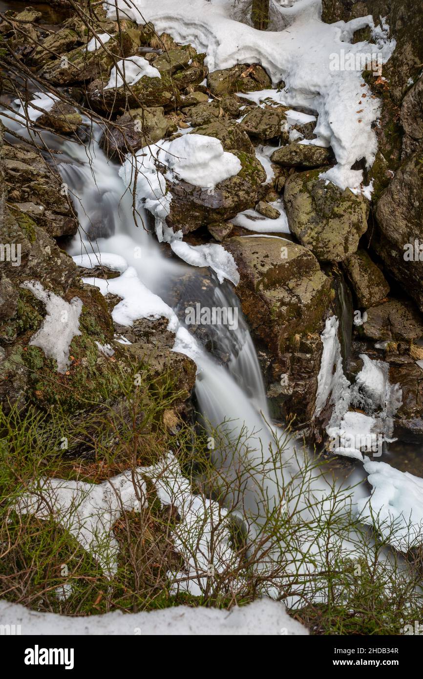 waterfall in the forest with snow Stock Photo - Alamy