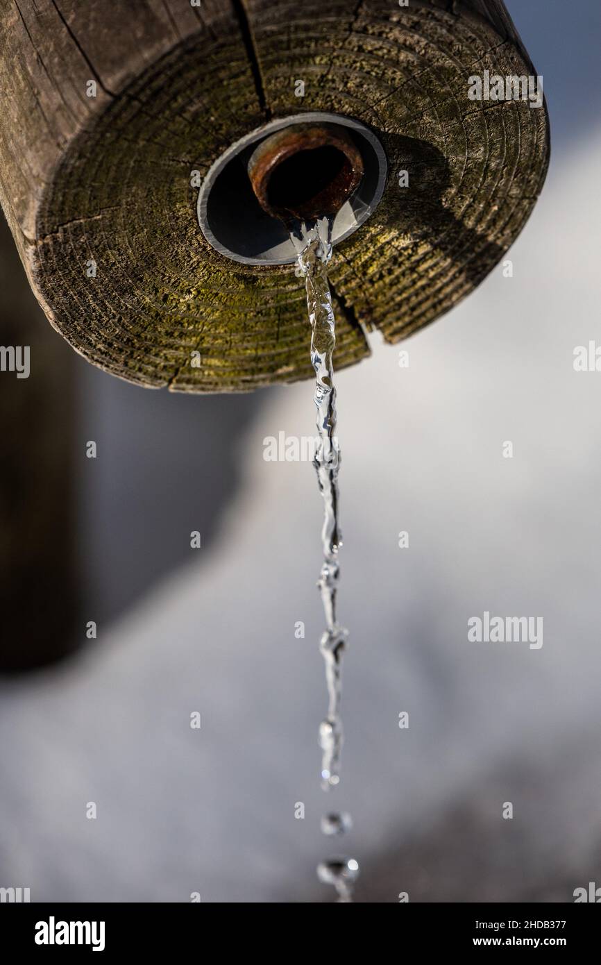 water flowing out of metal pipe at fountain Stock Photo - Alamy