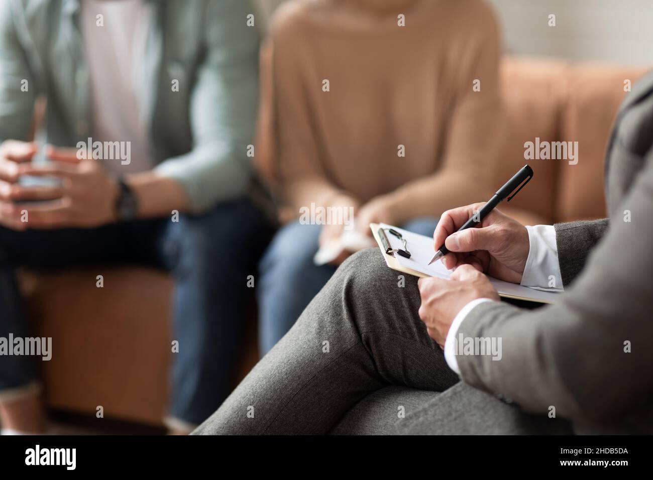 Couple having therapy session with male professional Stock Photo - Alamy