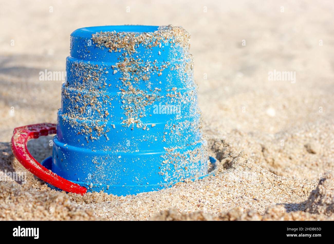 Children's bucket for playing with sand. Blue plastic bucket. Children ...