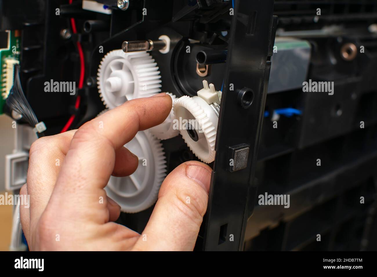 fingers of a person, the master of the service center, touch, pull out ...