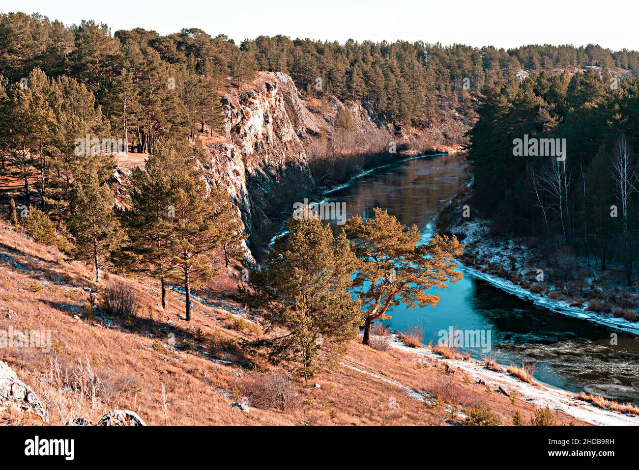 Autumn landscape with river and cliffs with pine forest, beautiful view ...