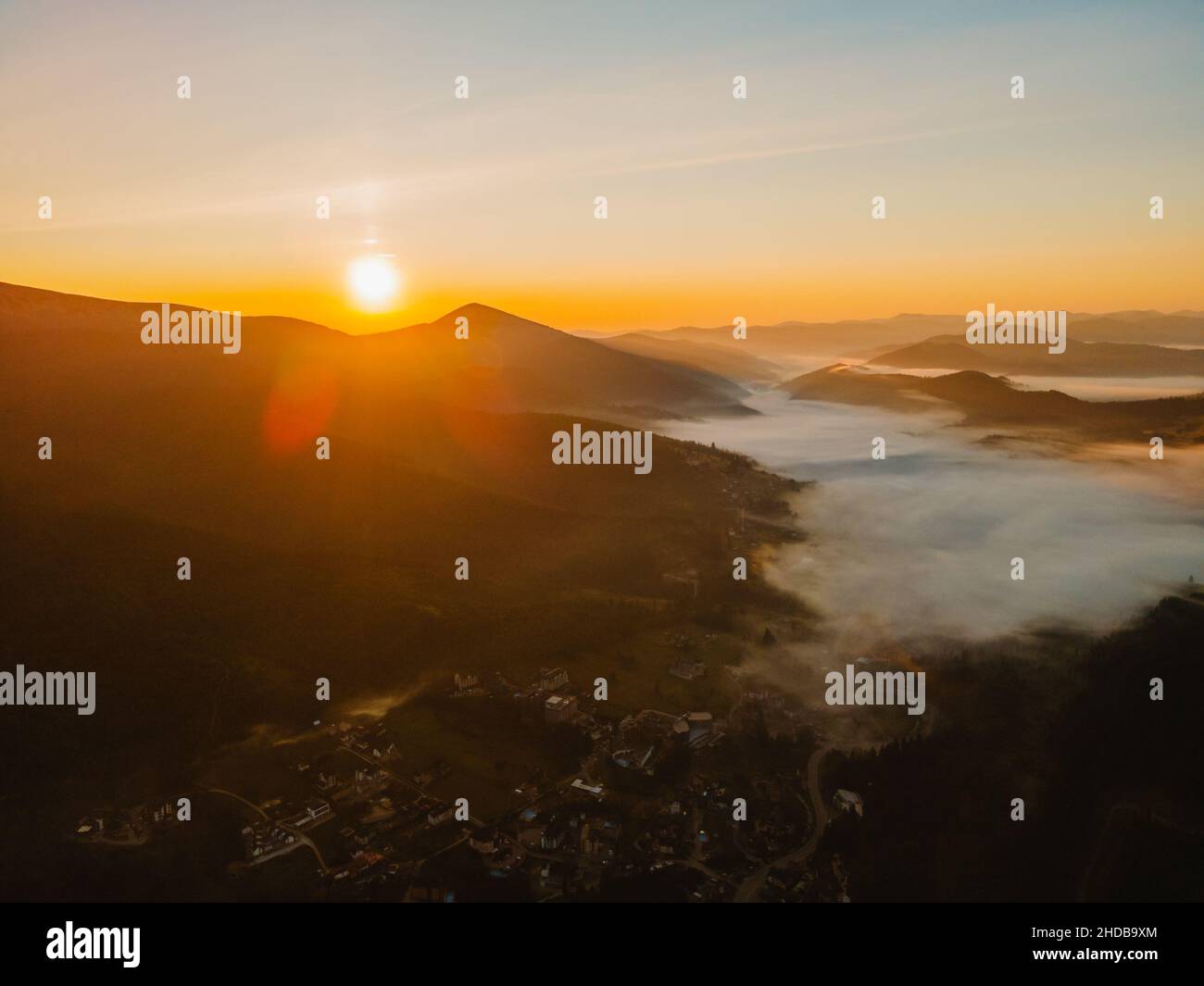 aerial view of sunrise above mountain range copy space Stock Photo - Alamy
