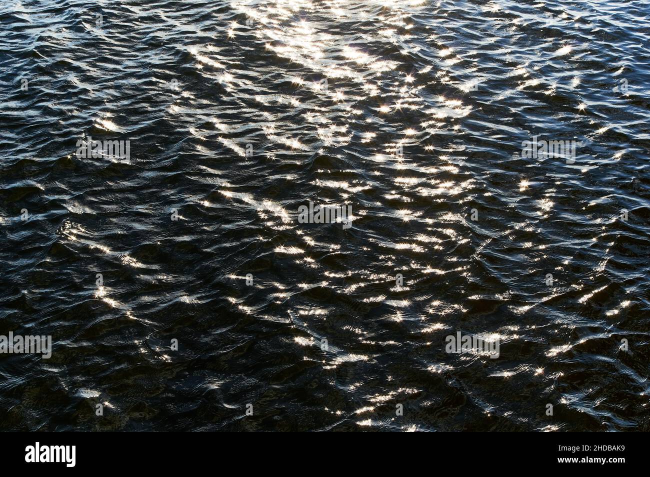 Waves reflect with light in water Stock Photo - Alamy