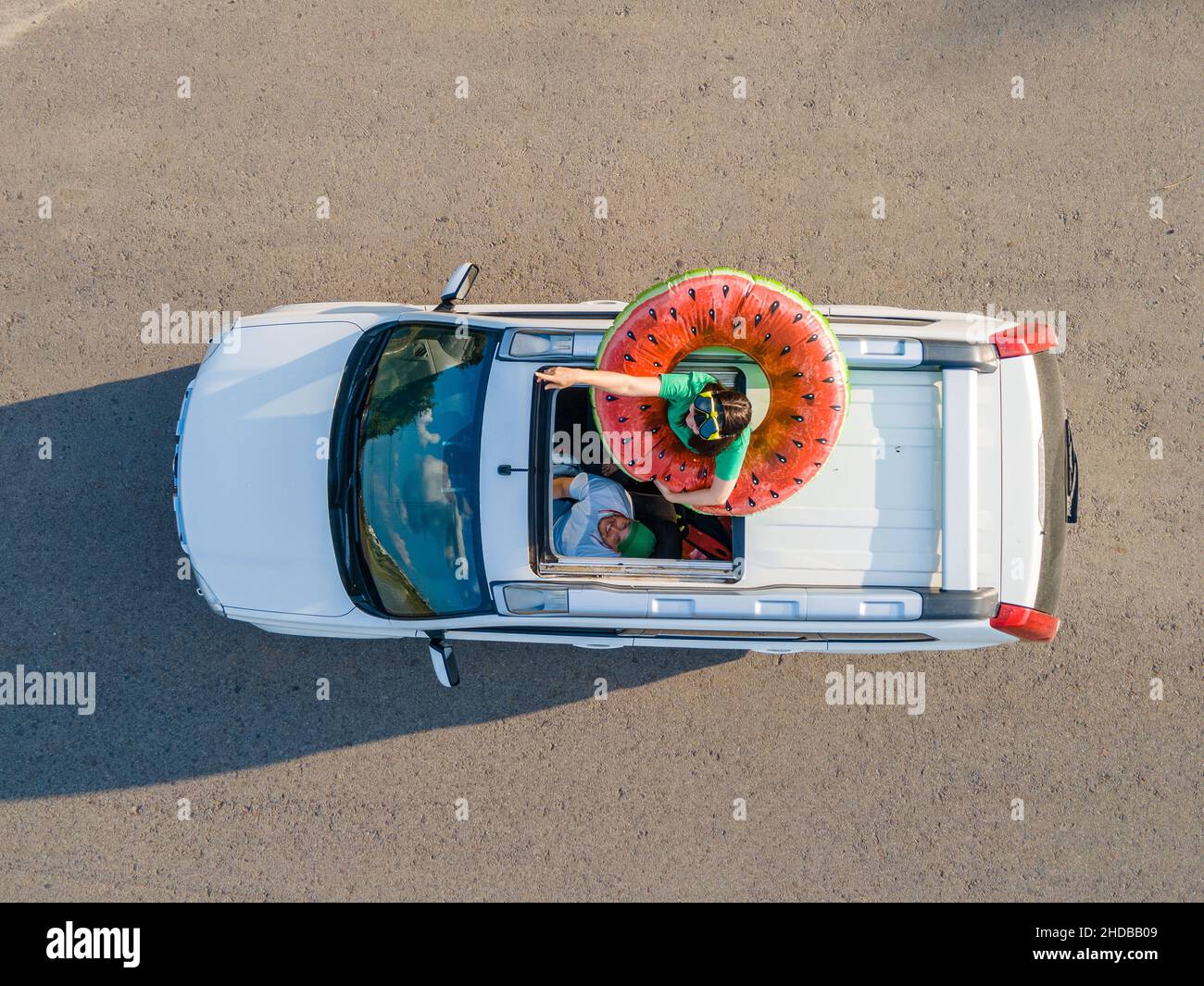 happy couple in car overhead view car travel to sea concept sunroof ...