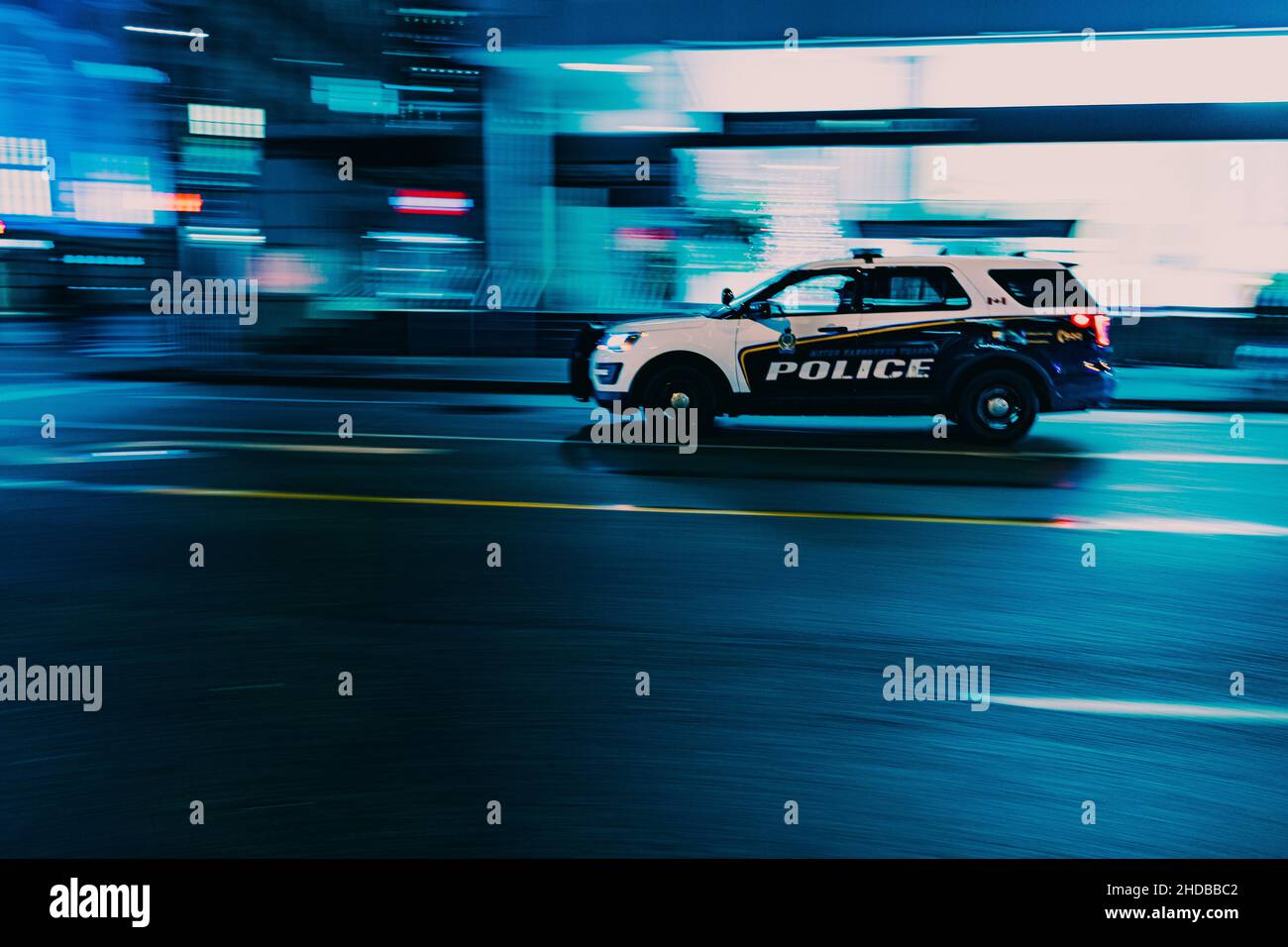 Vancouver Police Car driving through a dark cold street in Vancouver ...