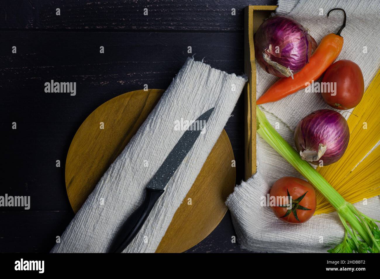 Top view of a messy kitchen table with a knife and ingredients Stock ...