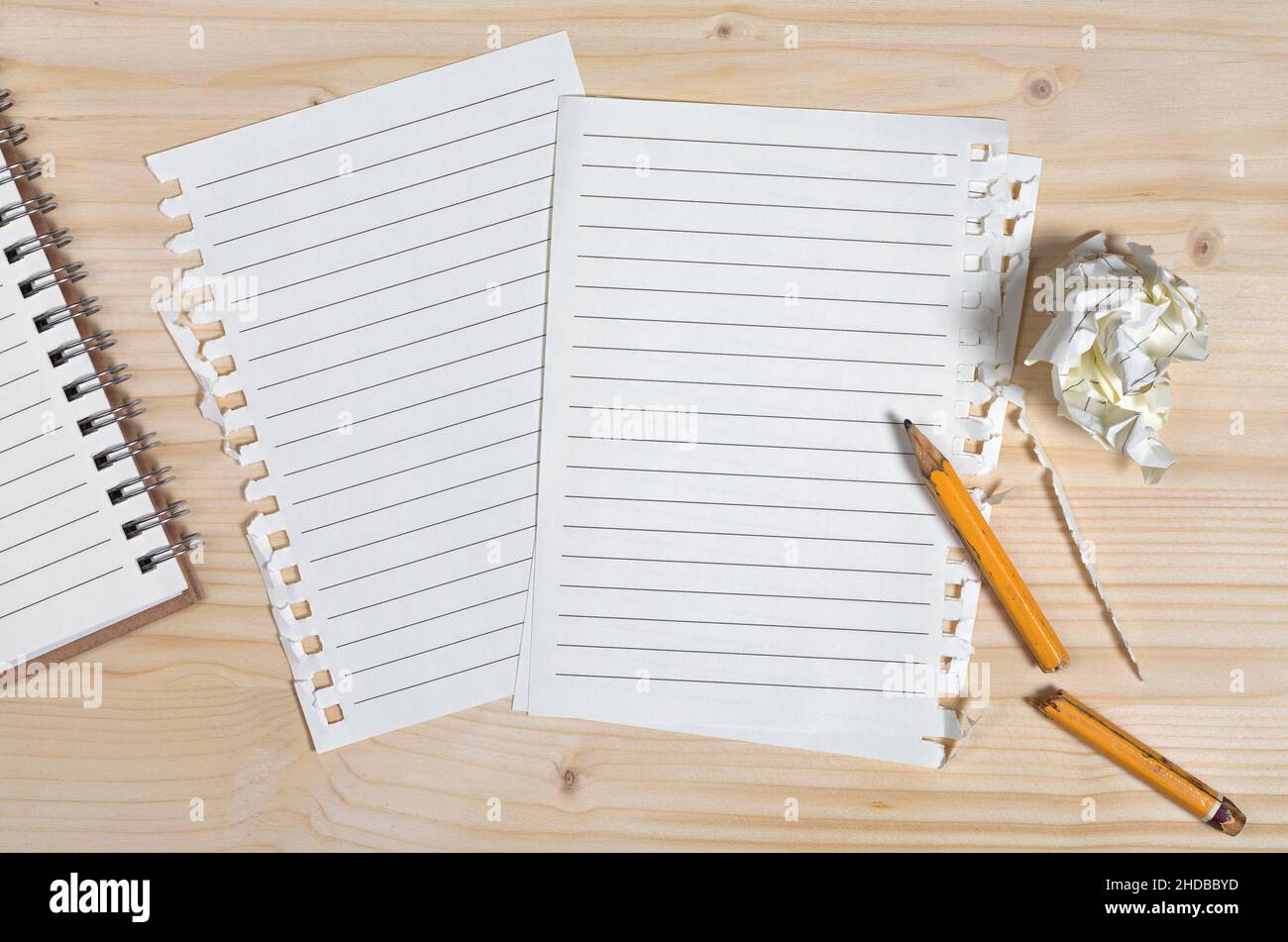 Clean sheets from notebook, broken pencil and crumpled paper against ...