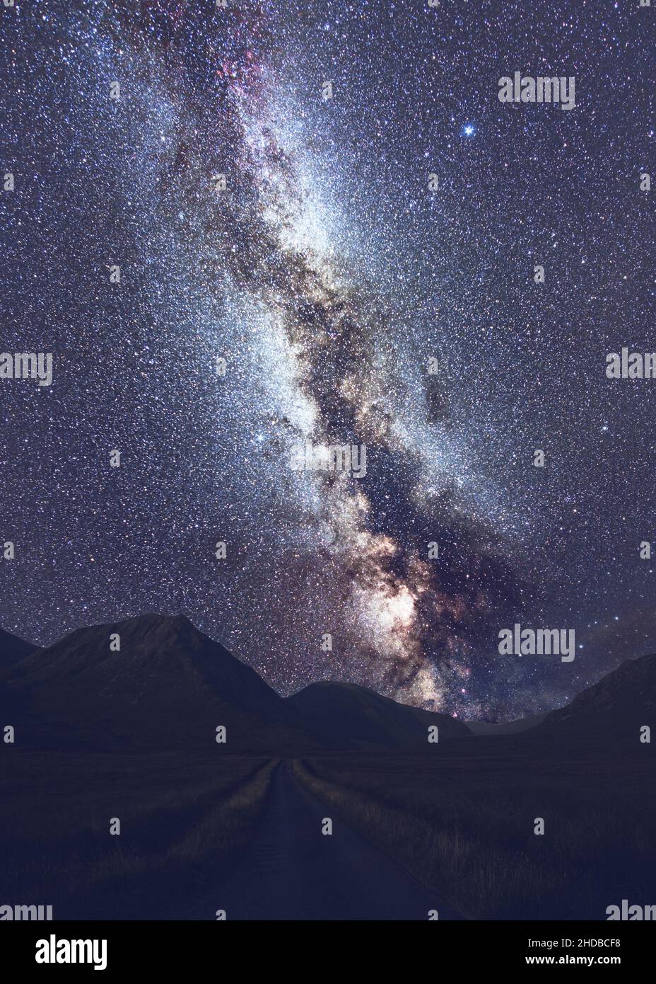 Vertical shot of the Milky Way behind the hills Stock Photo - Alamy