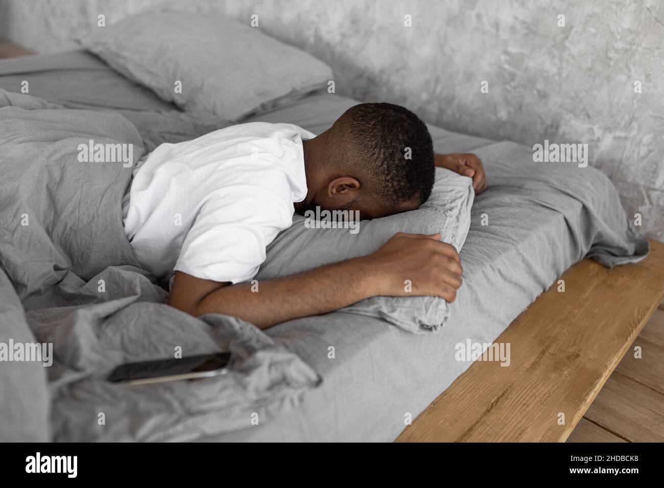 African american man sleeping in bed hi-res stock photography and ...