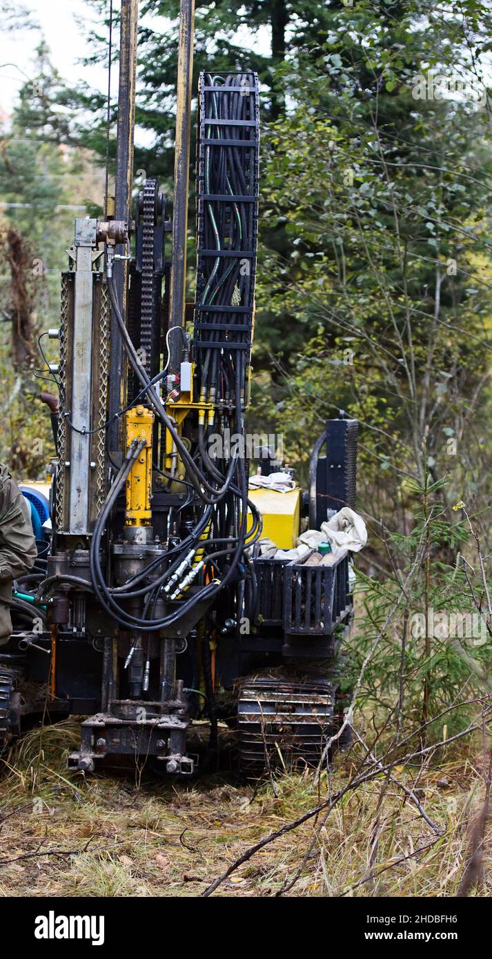 Self-propelled Mini-drilling rig drills the soil in forest conditions ...