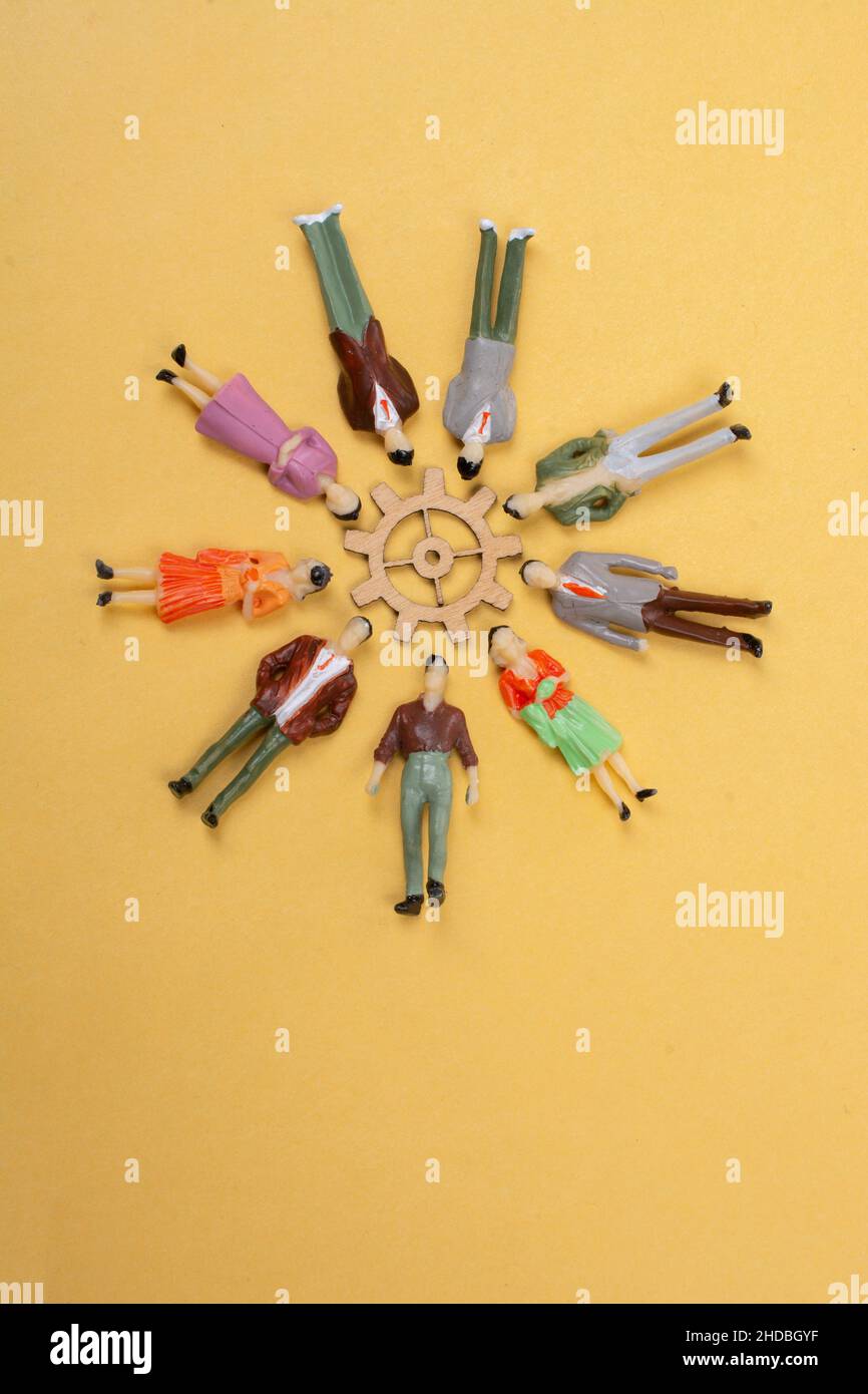 Colorful diverse miniature people figurines make crowd on ground Stock ...