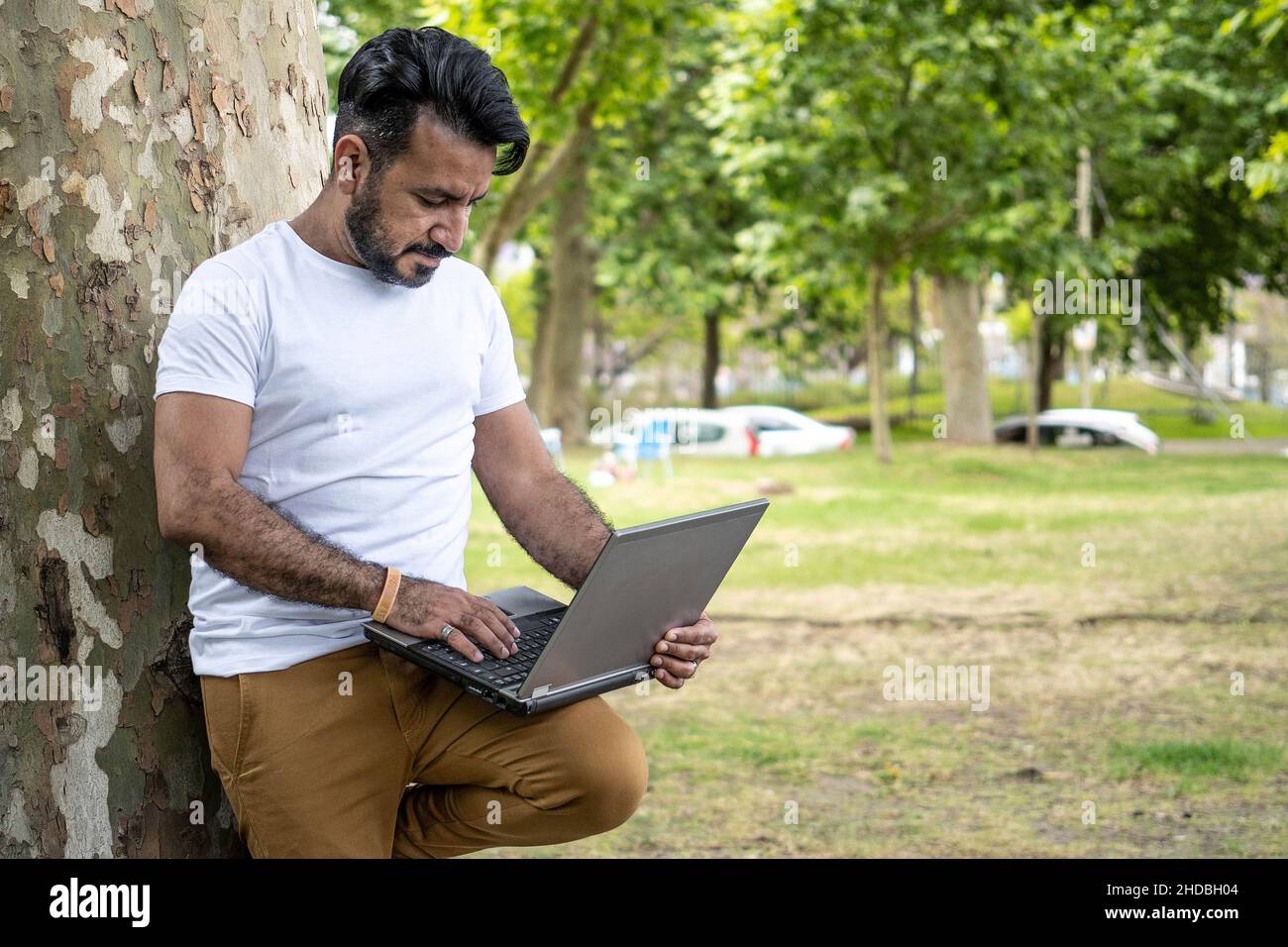 Leaning on laptop hi-res stock photography and images - Alamy