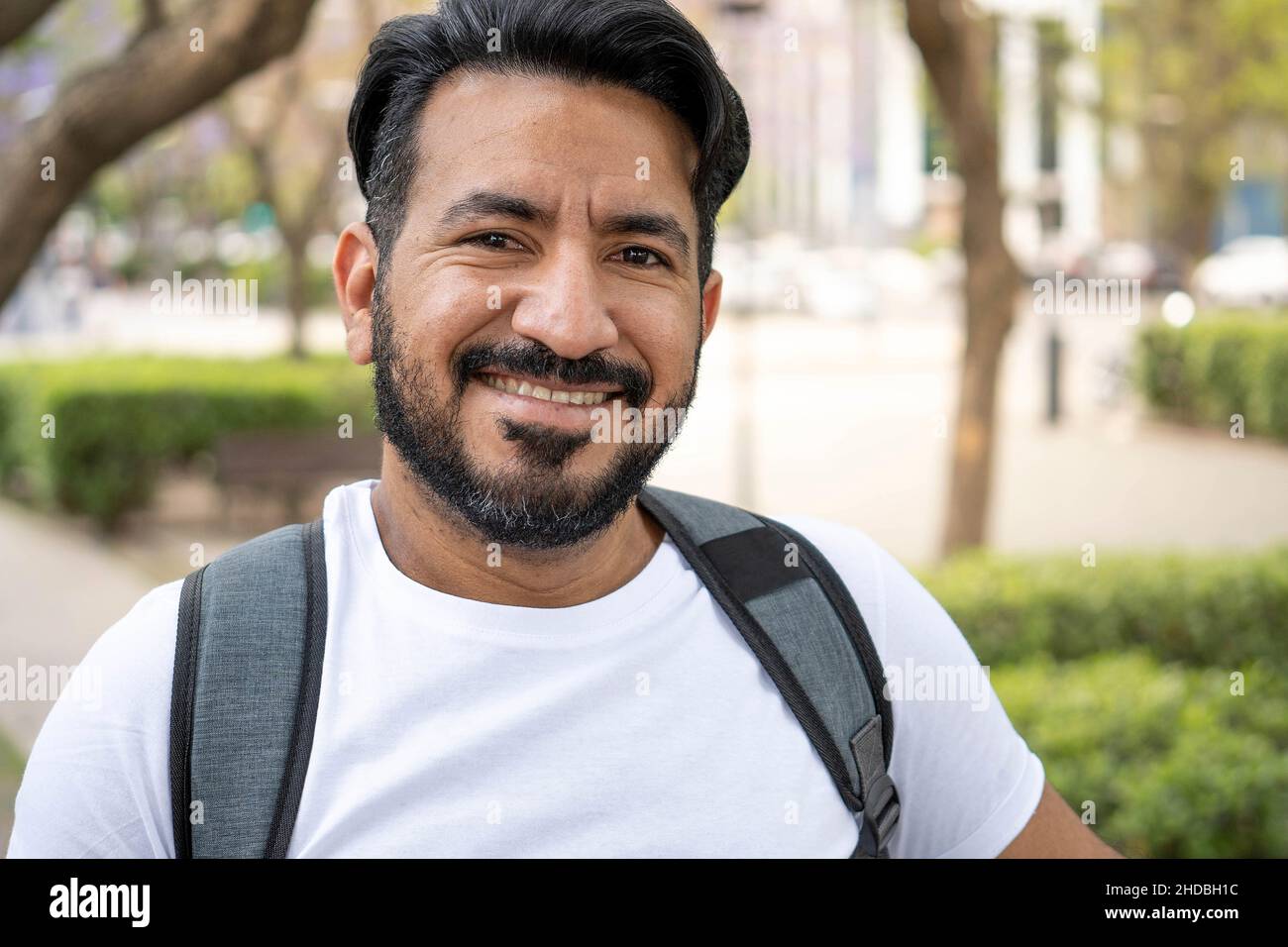 Smiling standing carrying looking at camera hi-res stock photography ...