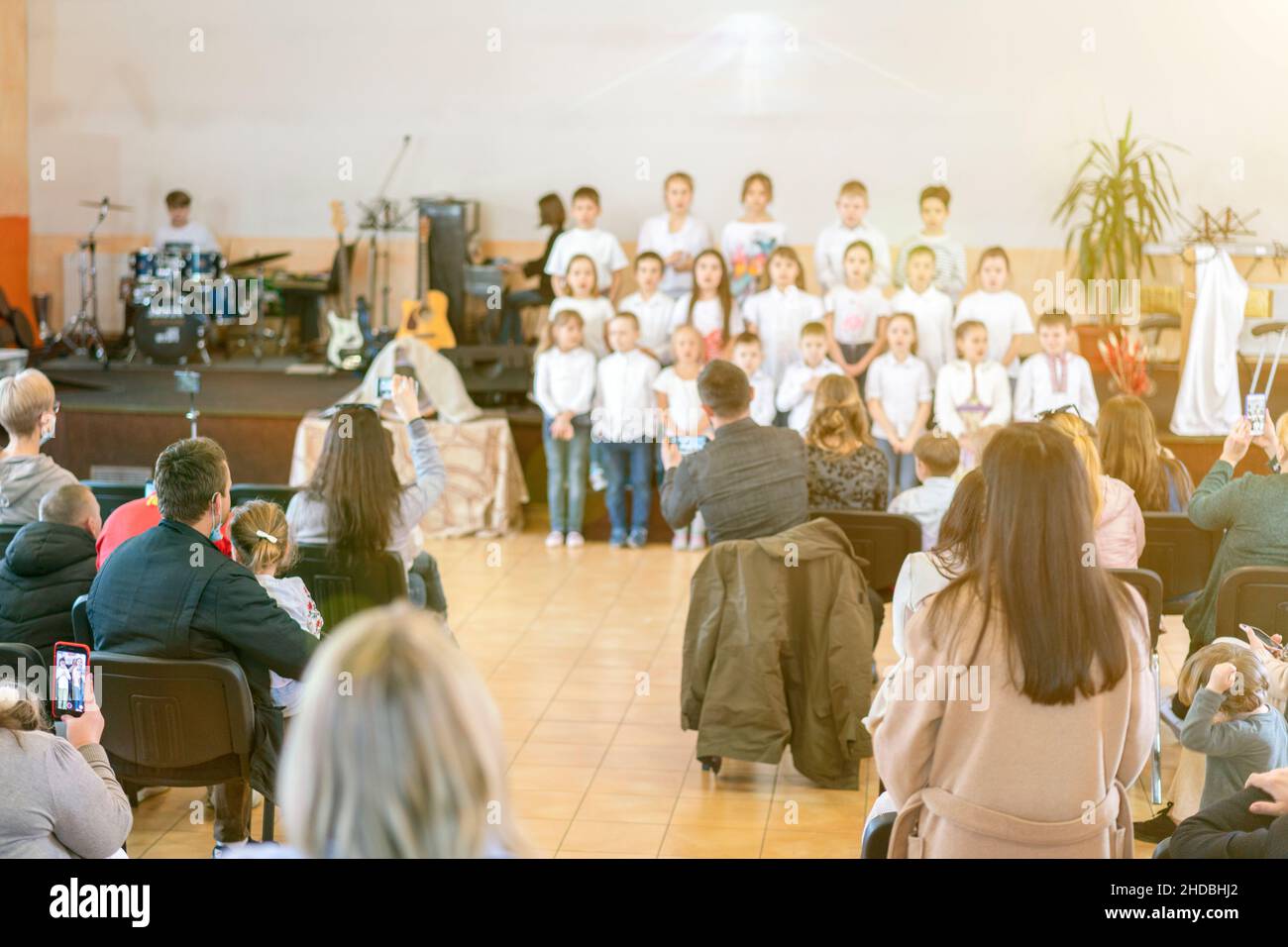 Children on the stage. Children on stage perform in front of parents ...
