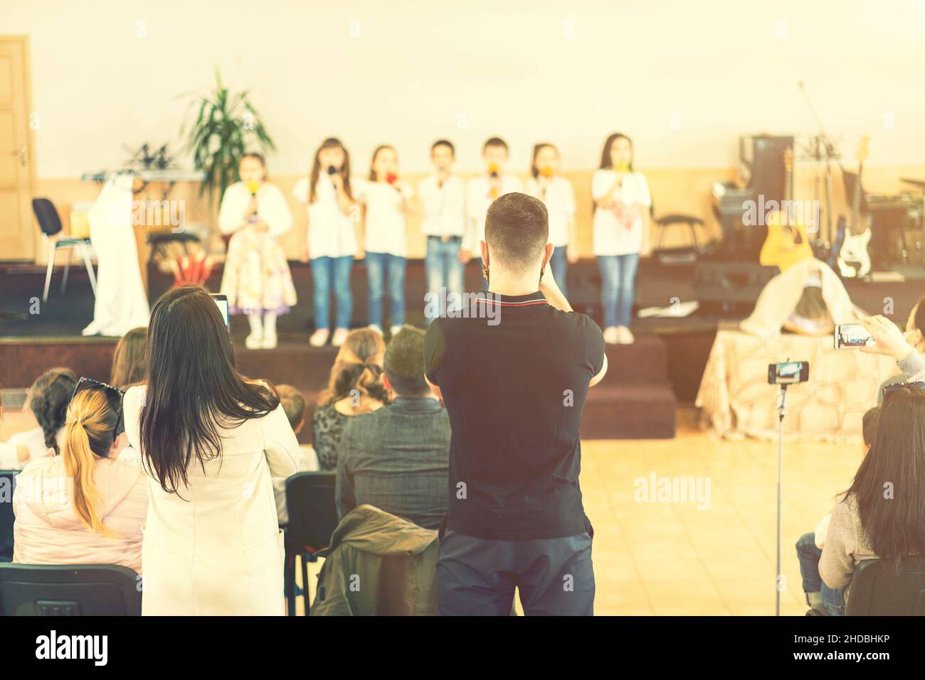 Children on the stage. Children on stage perform in front of parents ...